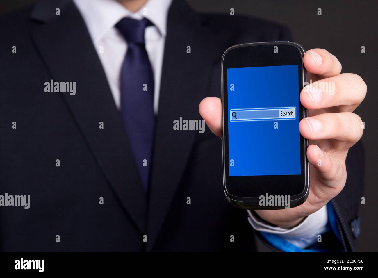 modern mobile phone with search bar on screen in business man hand ...