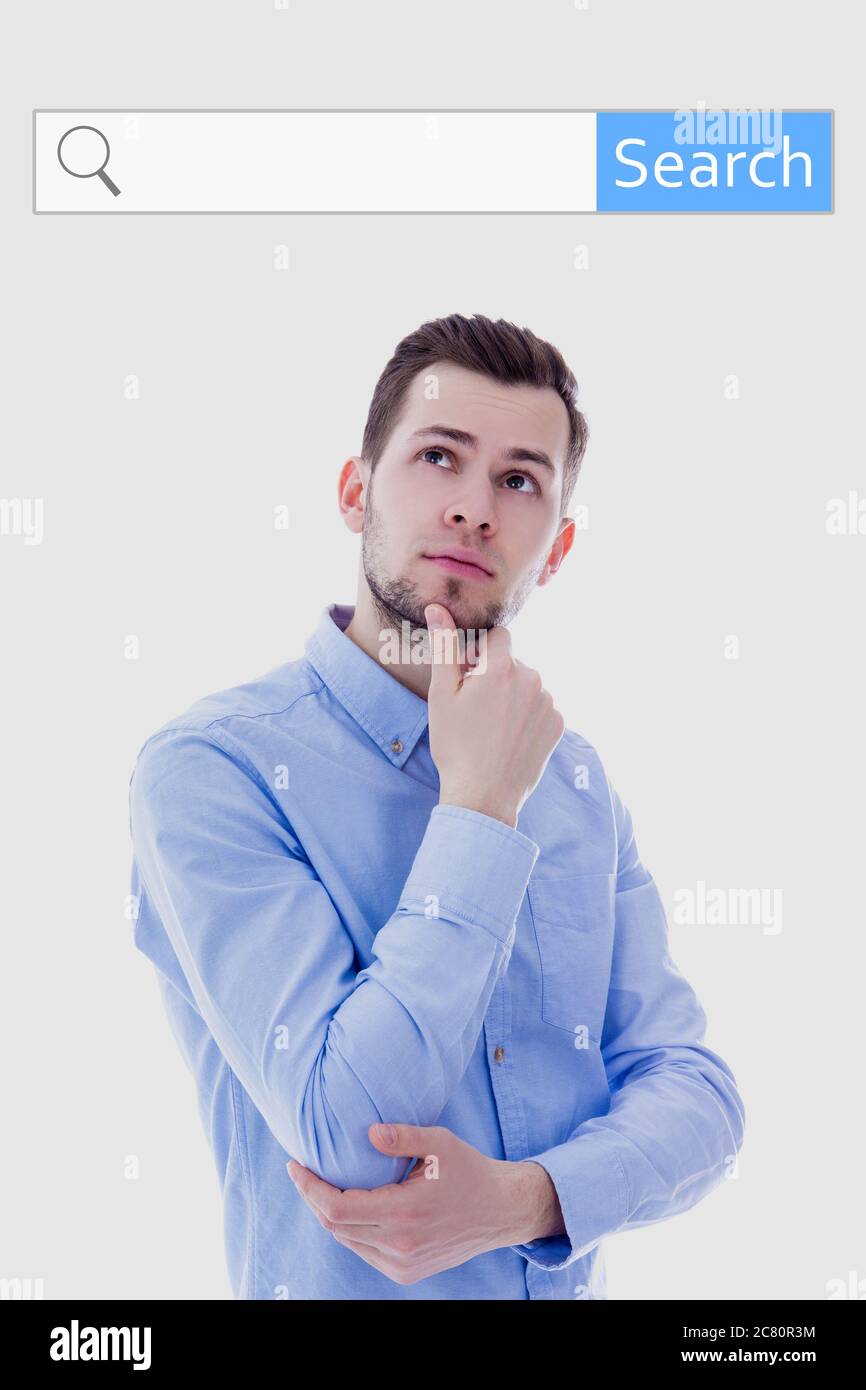 internet search concept - portrait of young man thinking about ...