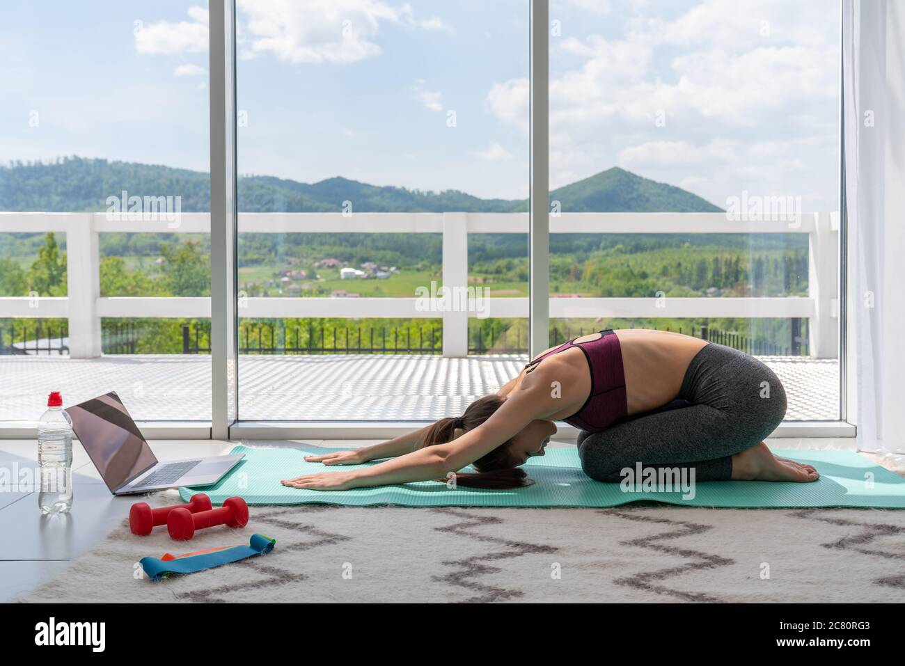 Yoga home stretching meditation woman doing childs pose warm up stretch ...
