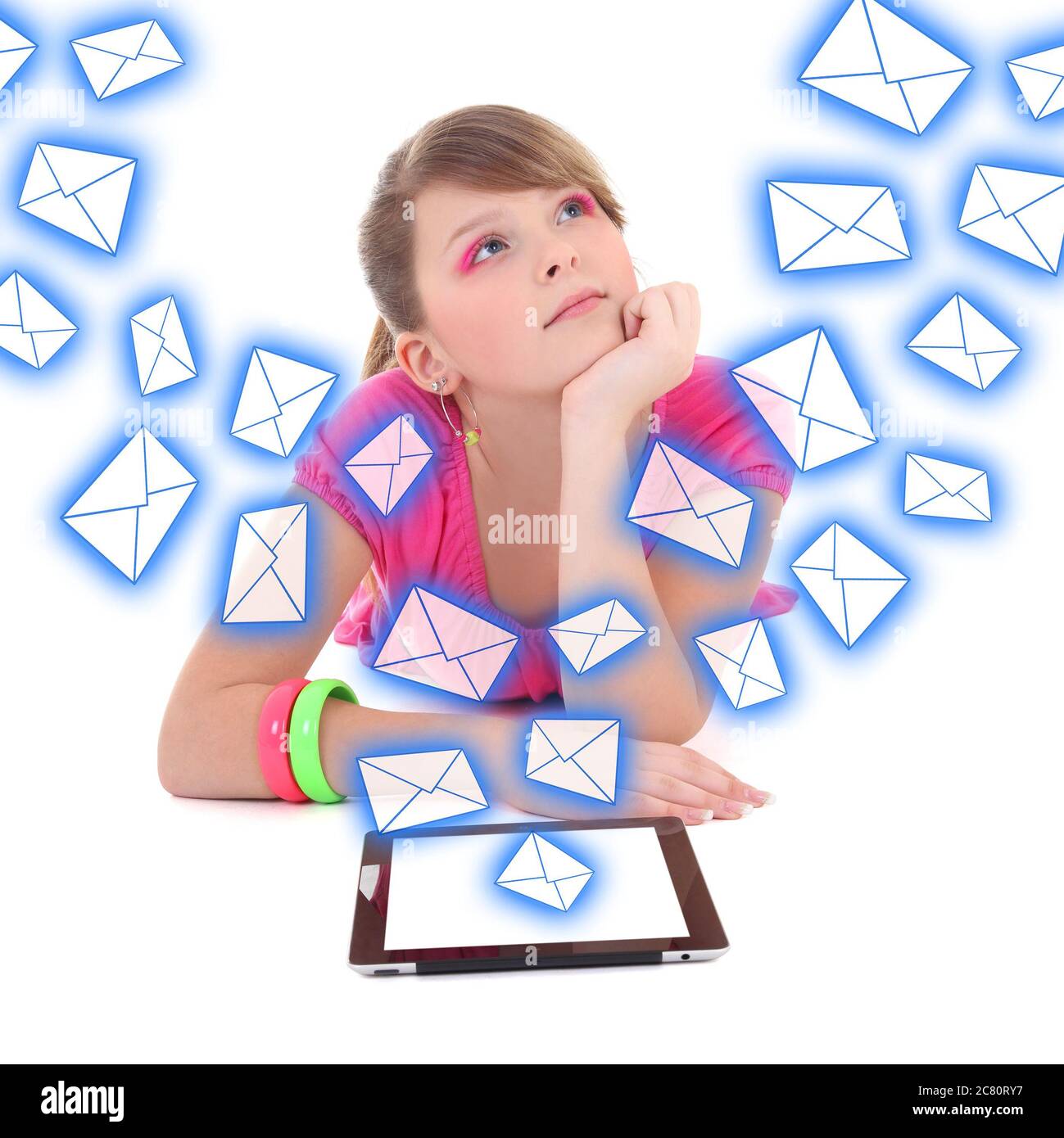 dreaming teenage girl with tablet pc and flying messages isolated on ...