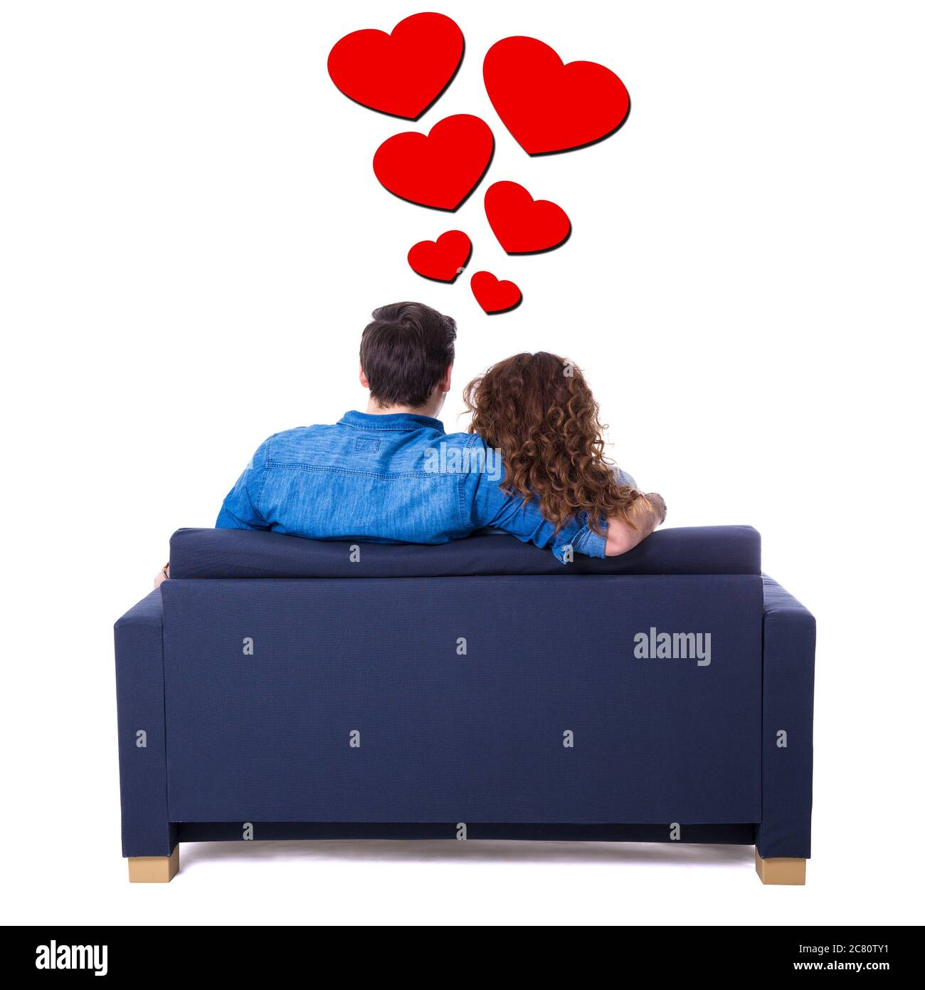 back view of young lovely couple sitting on sofa isolated on white ...
