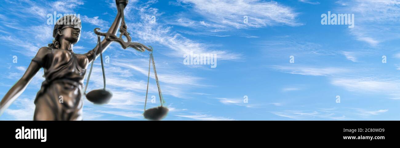 Side view of the statue of lady justice on a bright background with ...