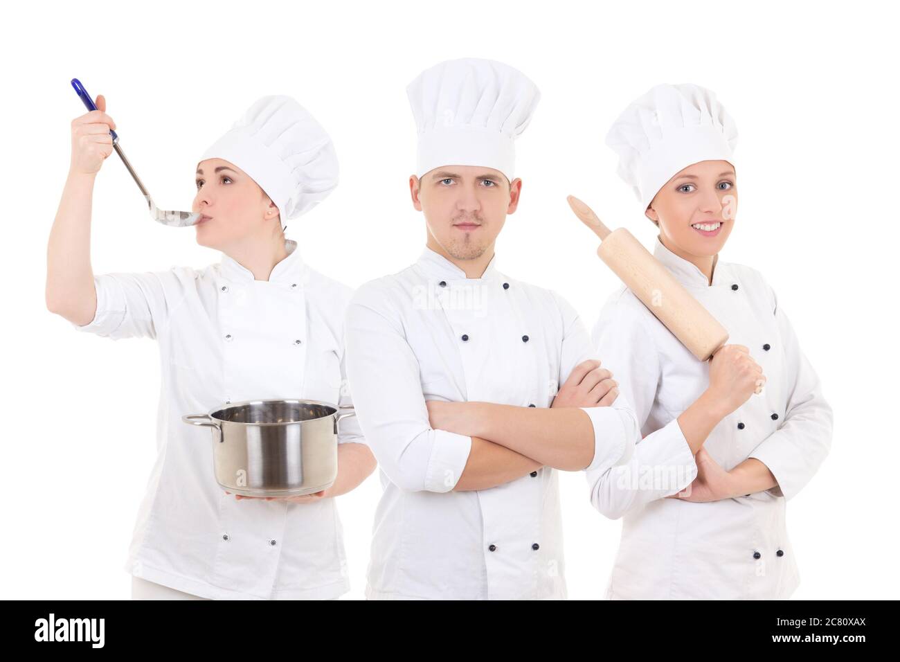 cooking concept - three young chefs isolated on white background Stock ...