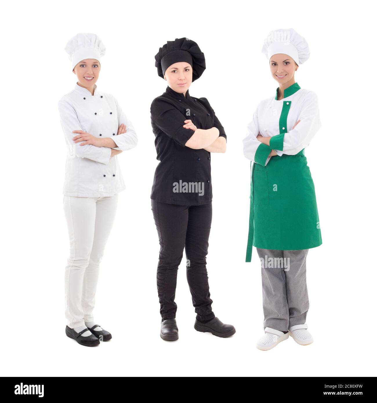 full length portrait of three young women chefs isolated on white ...