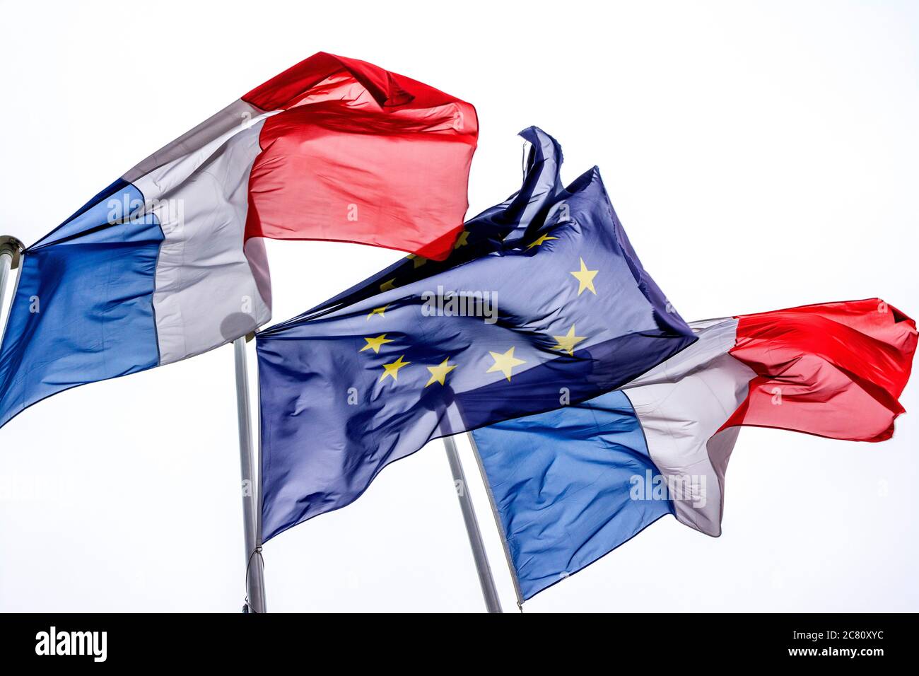 Flags of France and the European Union waving in the wind against a ...