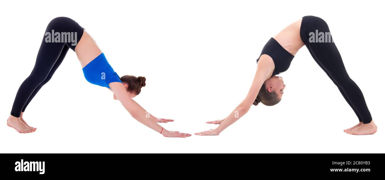 two young women standing in yoga pose isolated on white background ...
