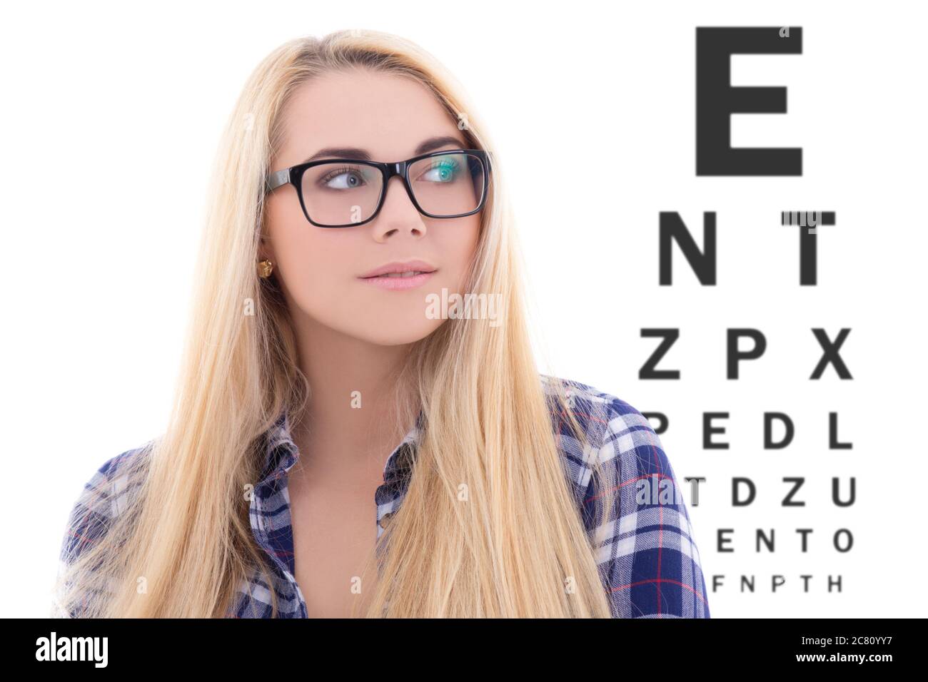 cute blondie girl in eyeglasses on the background of eye test chart ...