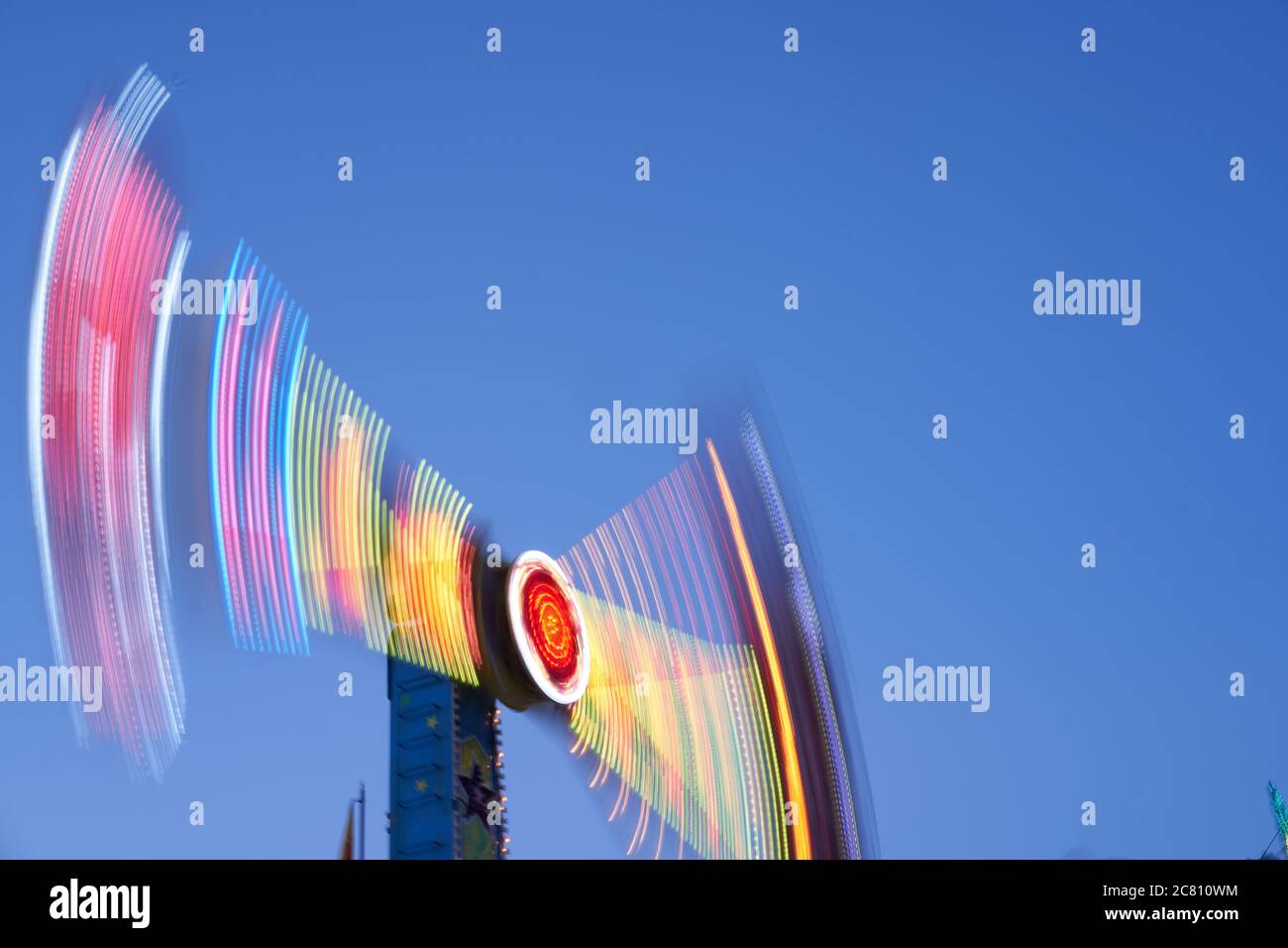 Amusement park blurred effect. Abstract illuminated background Spinning ...