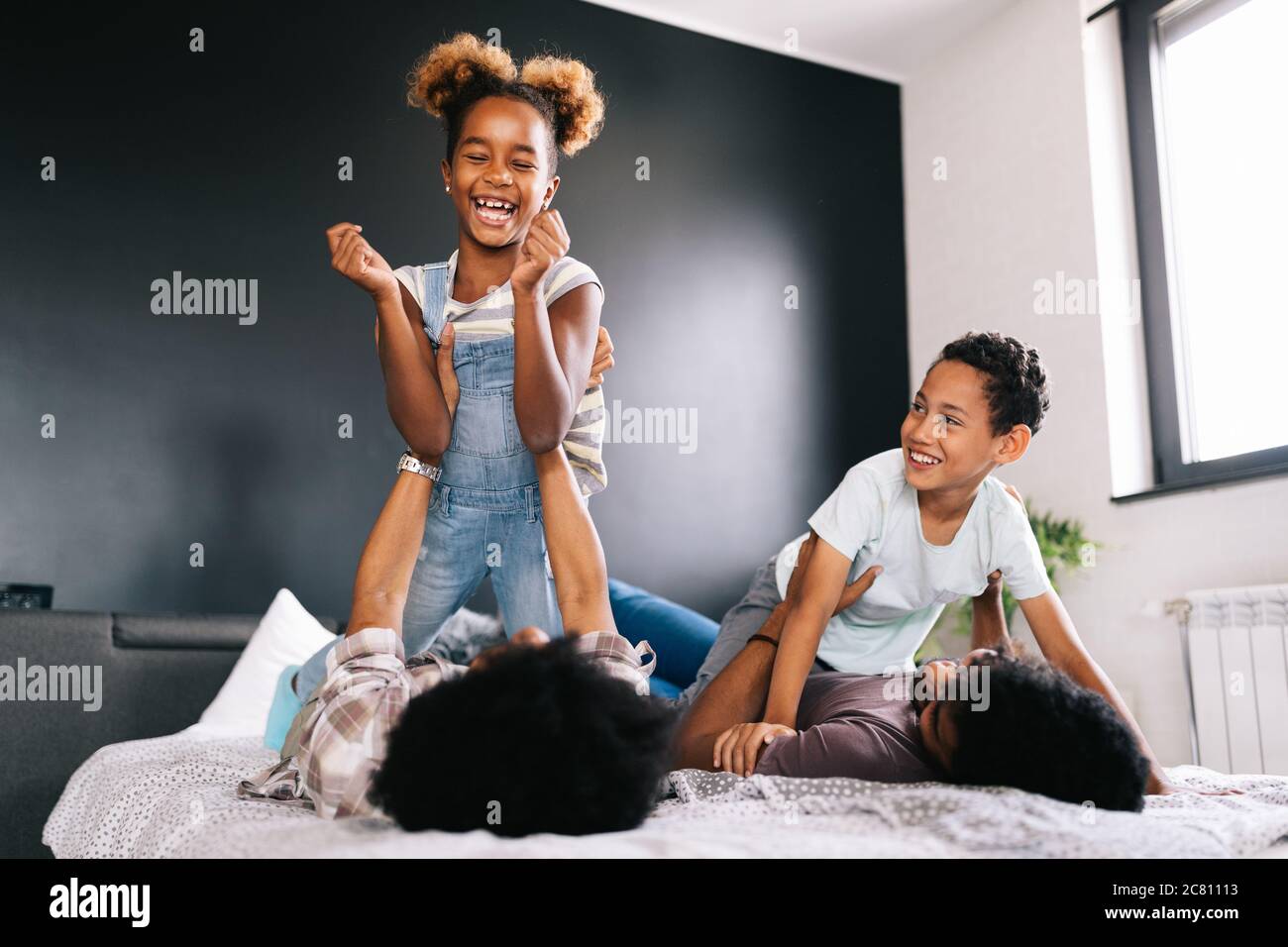 Happy african family enjoying spending time together at home Stock ...