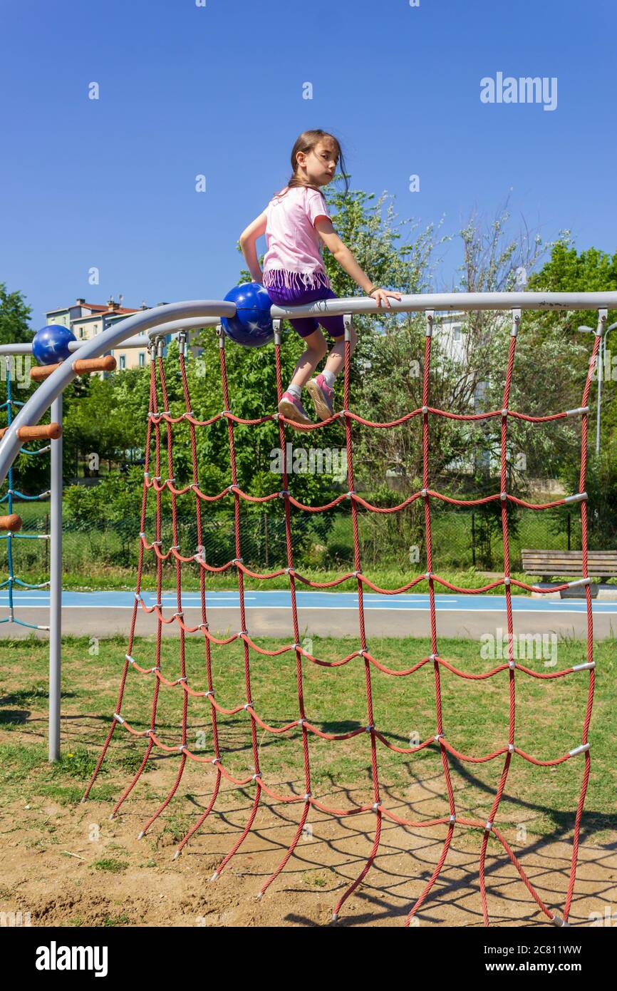 Teenage girl is playing at the playpen Stock Photo - Alamy