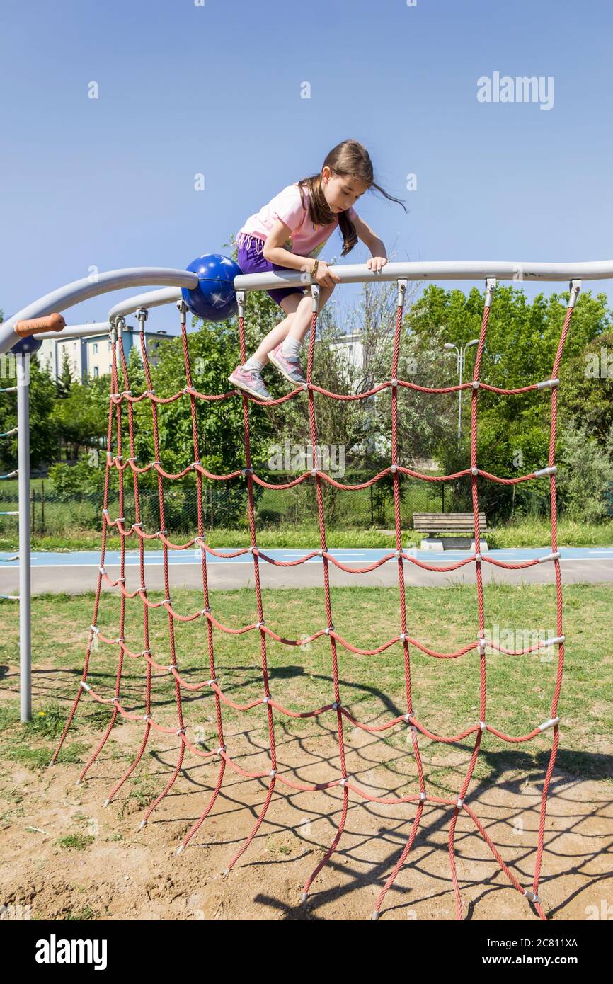 Teenage girl is playing at the playpen Stock Photo - Alamy
