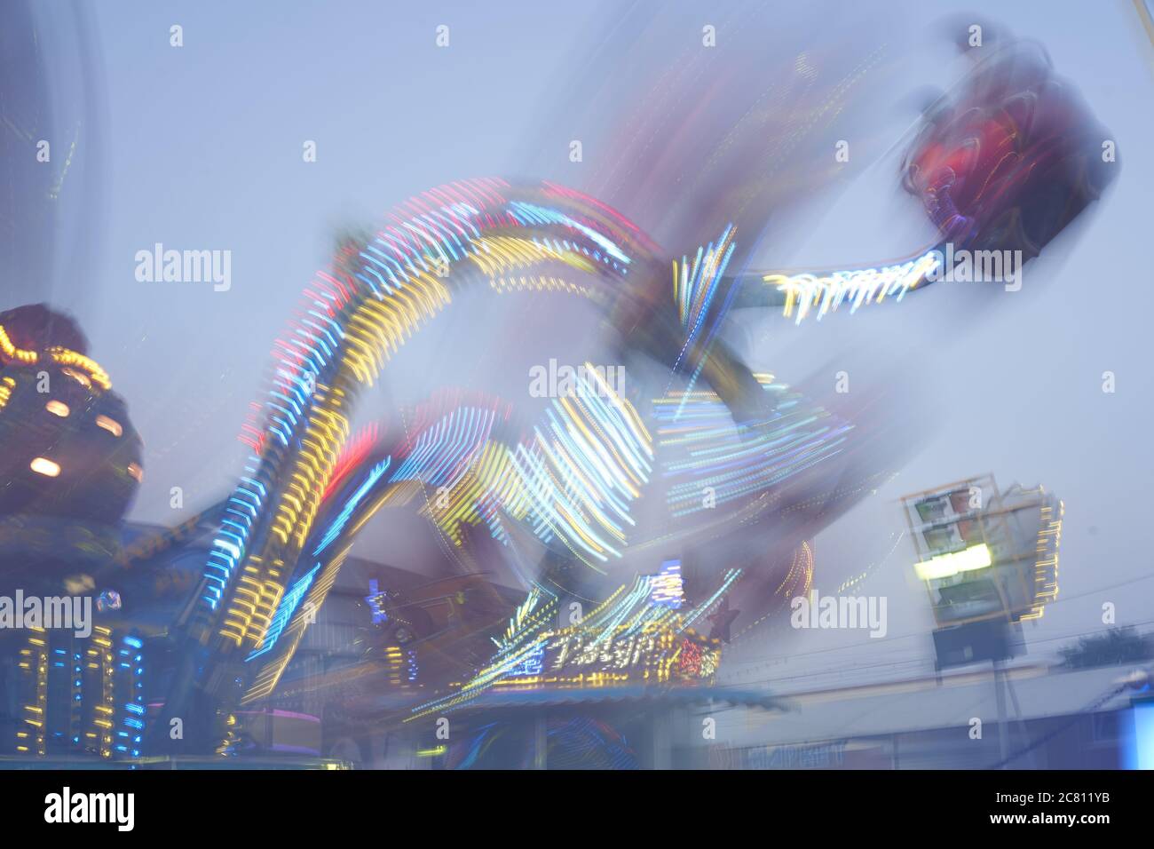 Amusement park blurred effect. Abstract illuminated background Spinning ...