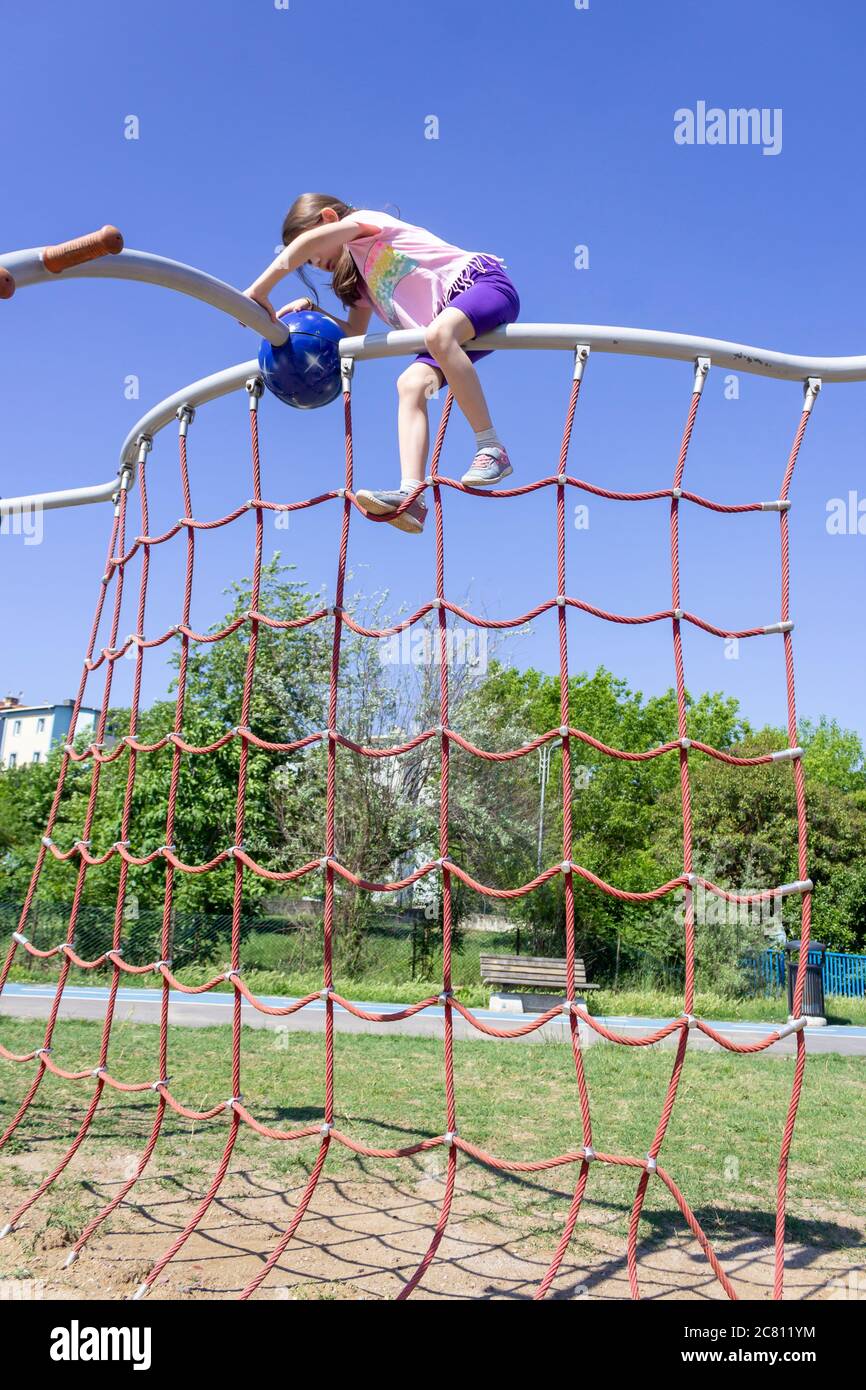 Teenage girl is playing at the playpen Stock Photo - Alamy