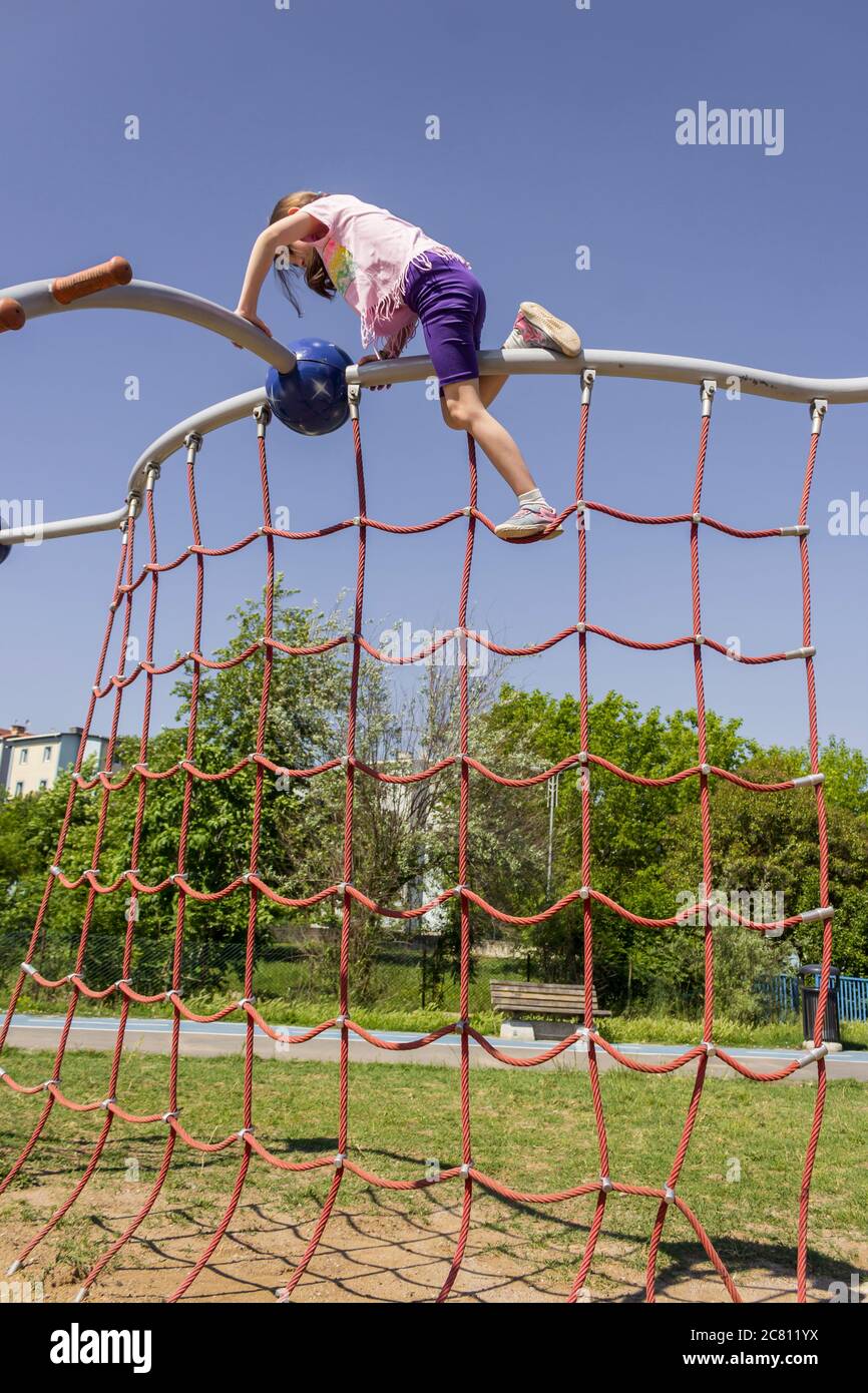 Teenage girl is playing at the playpen Stock Photo - Alamy