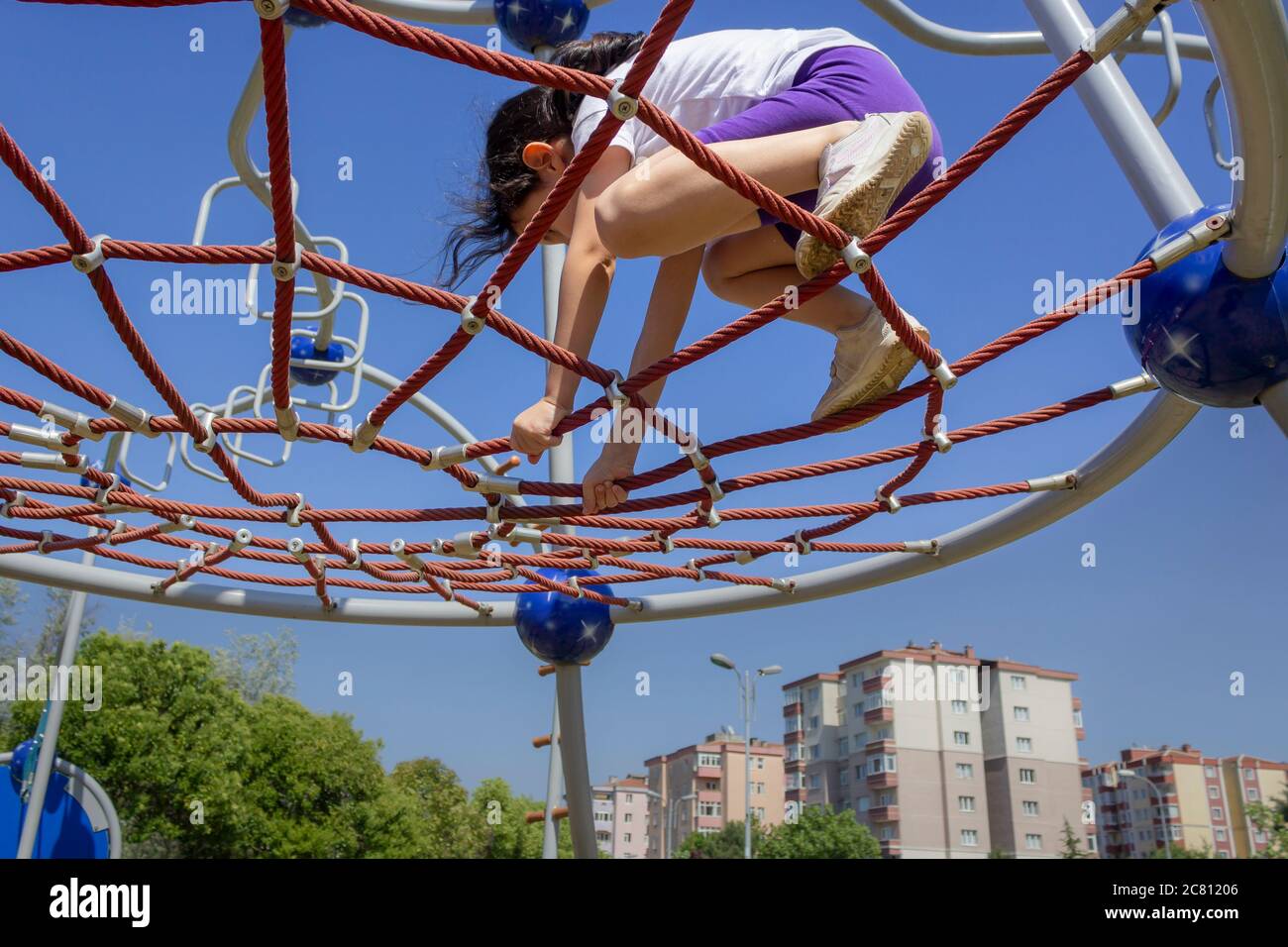 Teenage girl is playing at the playpen Stock Photo - Alamy