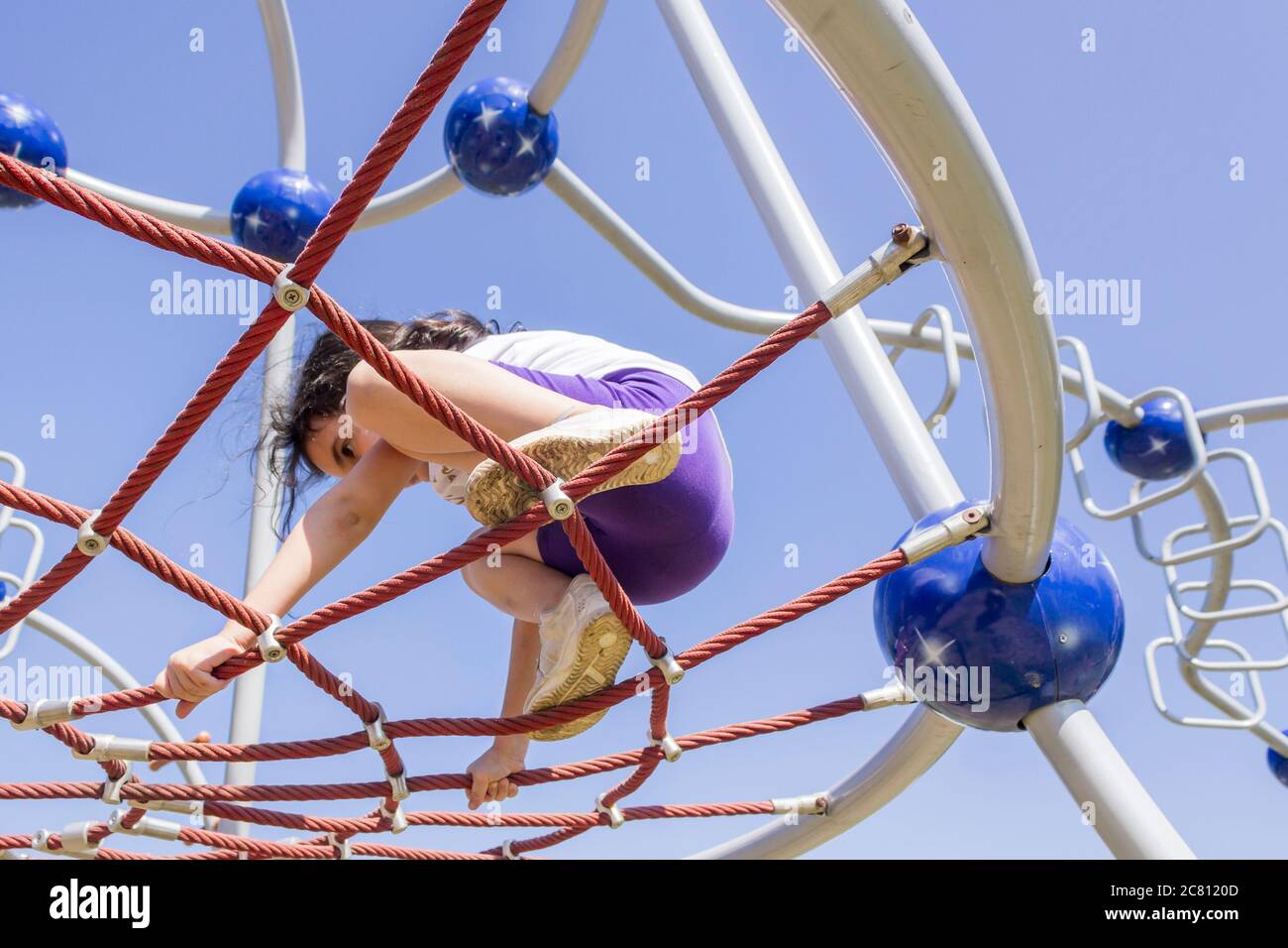 Teenage girl is playing at the playpen Stock Photo - Alamy