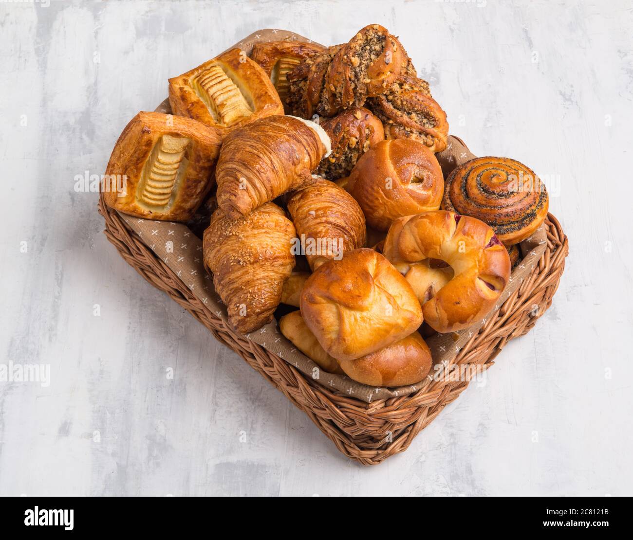 French croissants and pastry products in the basket. Top view Stock ...