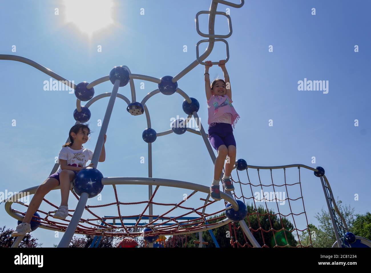 Teenage girl is playing at the playpen Stock Photo - Alamy