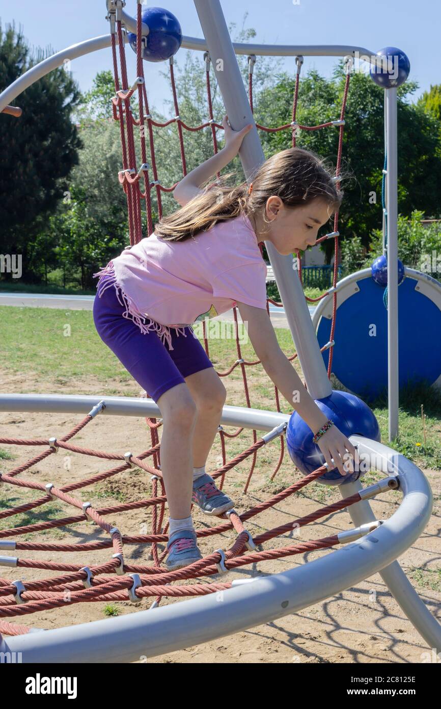 Teenage girl is playing at the playpen Stock Photo - Alamy