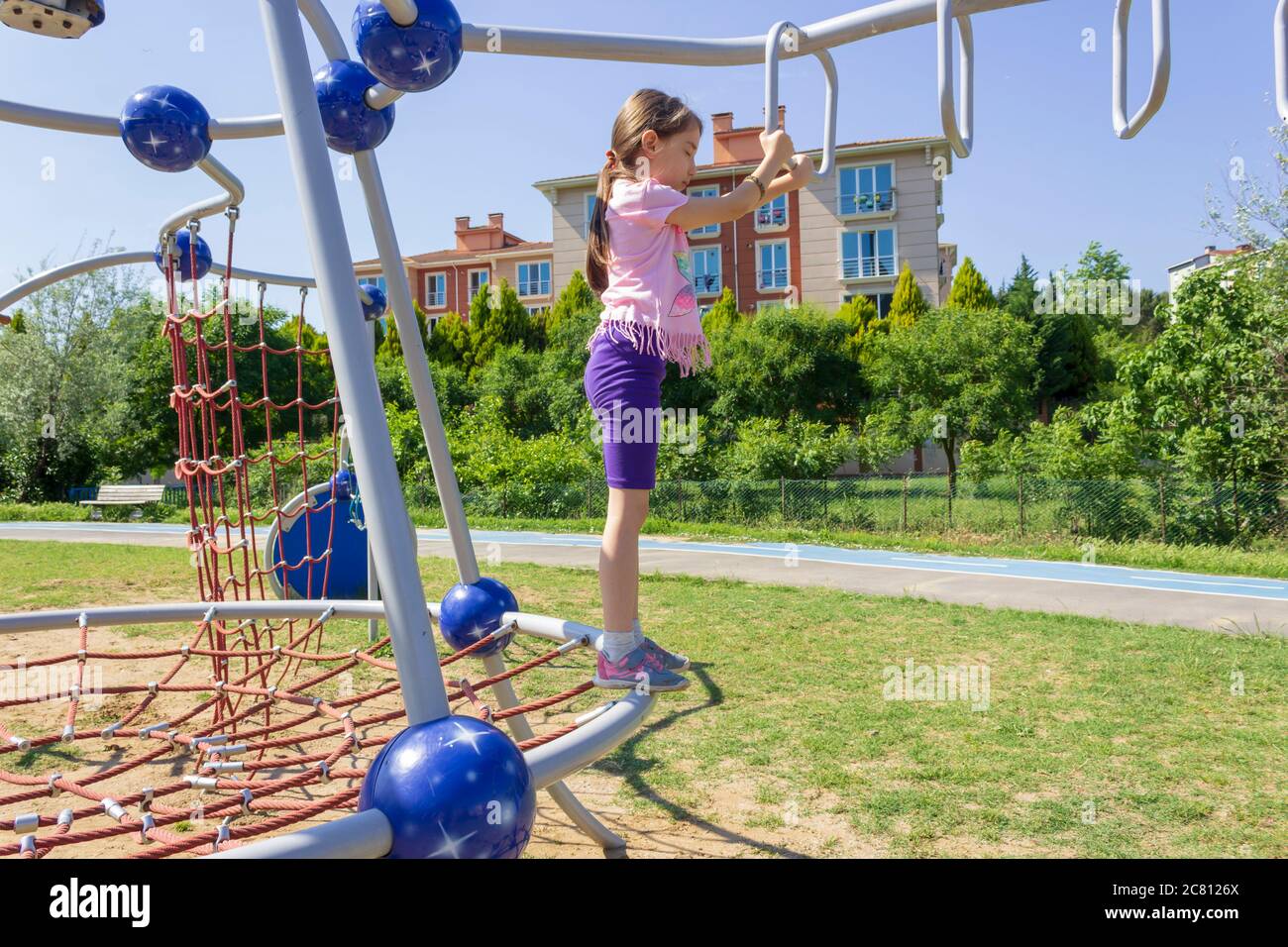 Teenage girl is playing at the playpen Stock Photo - Alamy