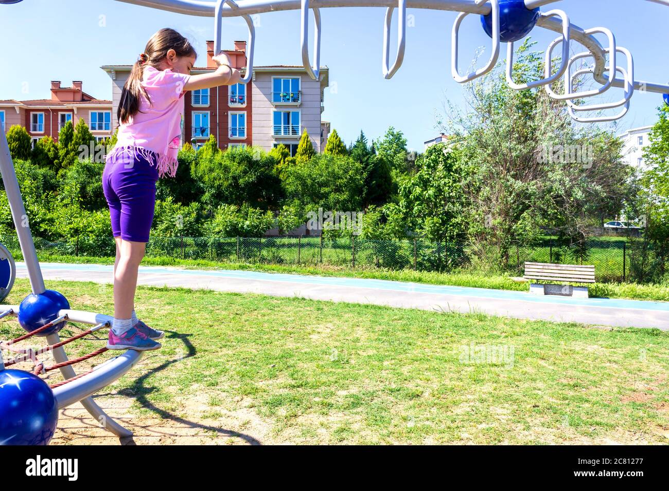 Teenage girl is playing at the playpen Stock Photo - Alamy