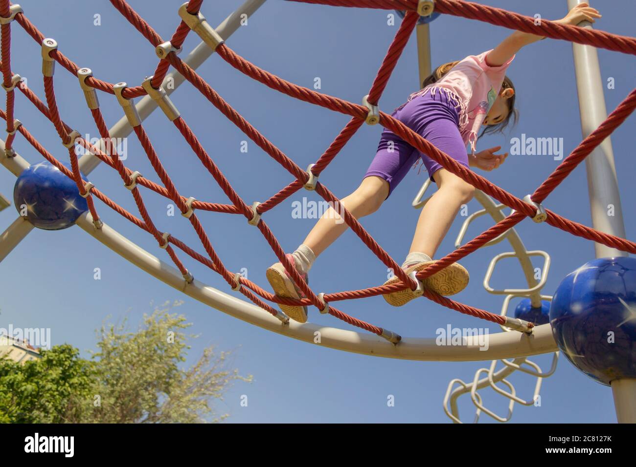 Teenage girl is playing at the playpen Stock Photo - Alamy