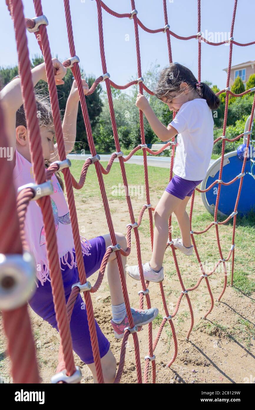 Teenage girl is playing at the playpen Stock Photo - Alamy