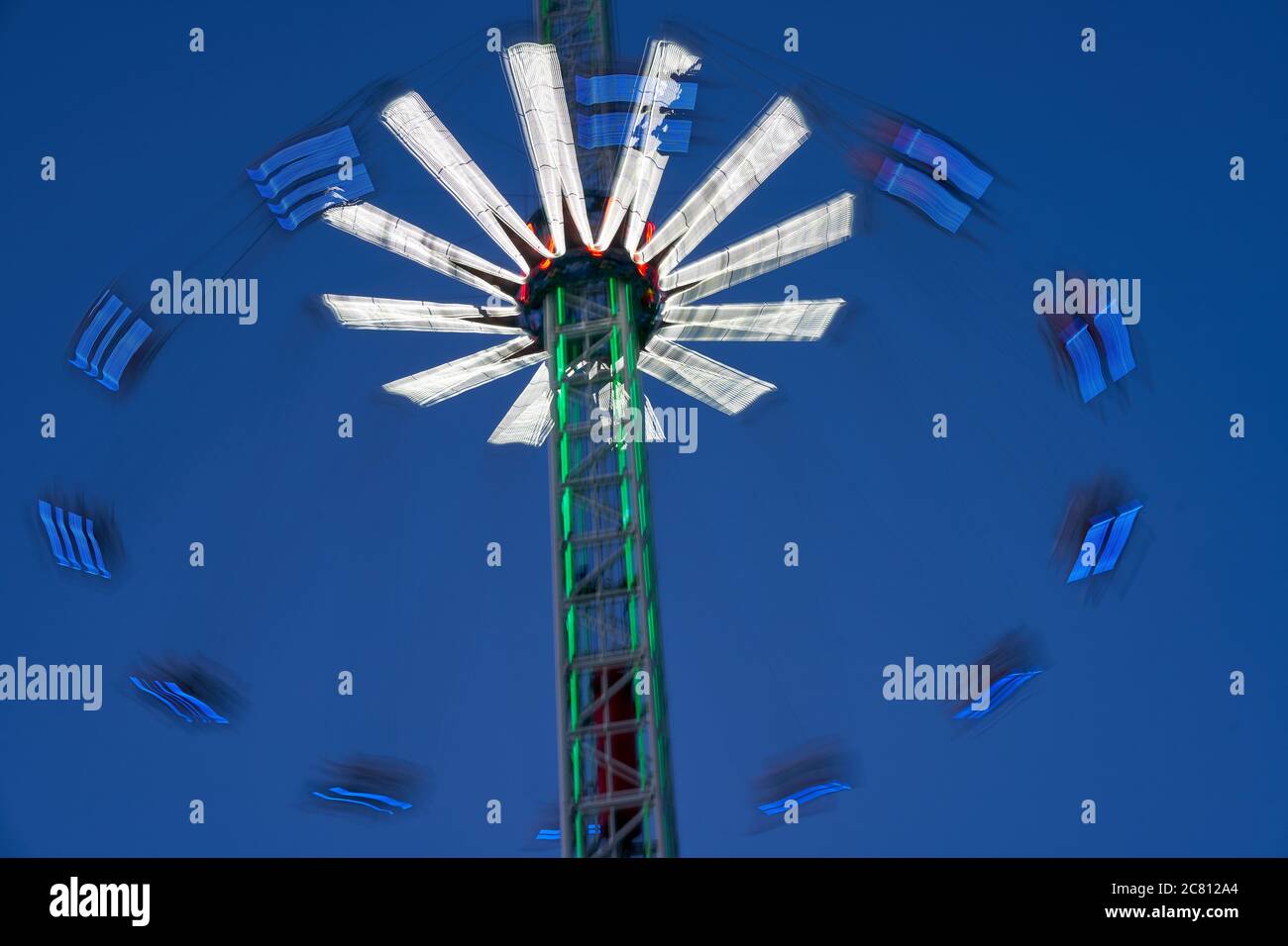 Amusement park blurred effect. Abstract illuminated background Spinning ...