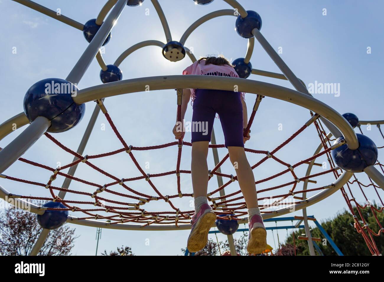 Teenage girl is playing at the playpen Stock Photo - Alamy