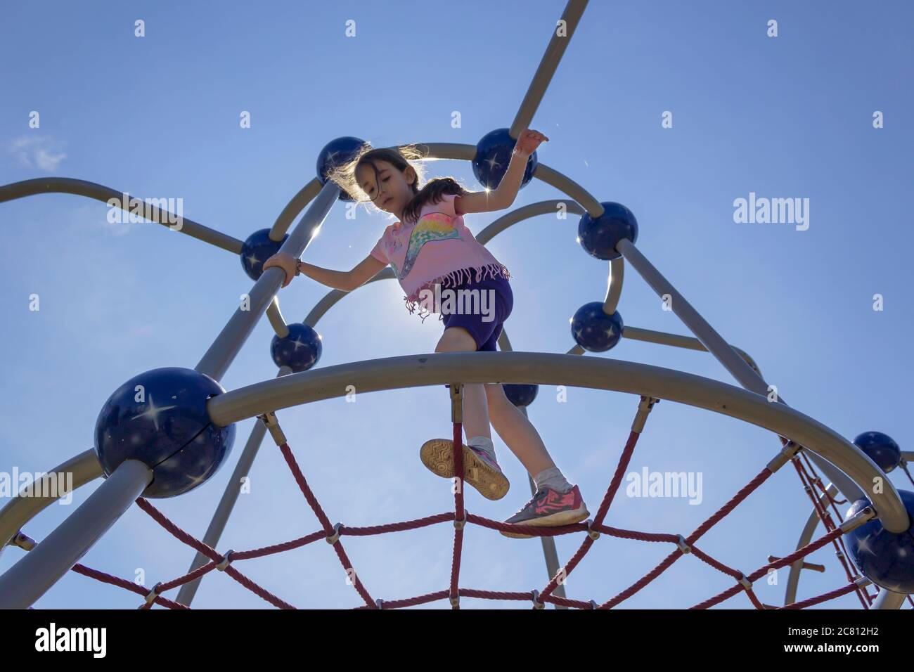 Teenage girl is playing at the playpen Stock Photo - Alamy