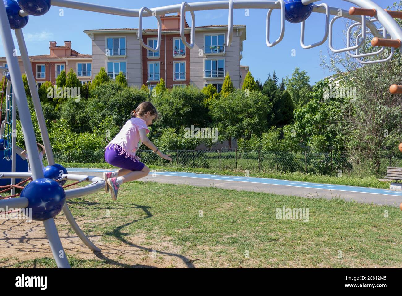 Teenage girl is playing at the playpen Stock Photo - Alamy