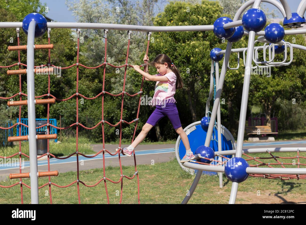 Teenage girl is playing at the playpen Stock Photo - Alamy