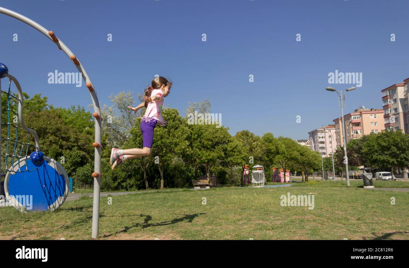 Teenage girl is playing at the playpen Stock Photo - Alamy