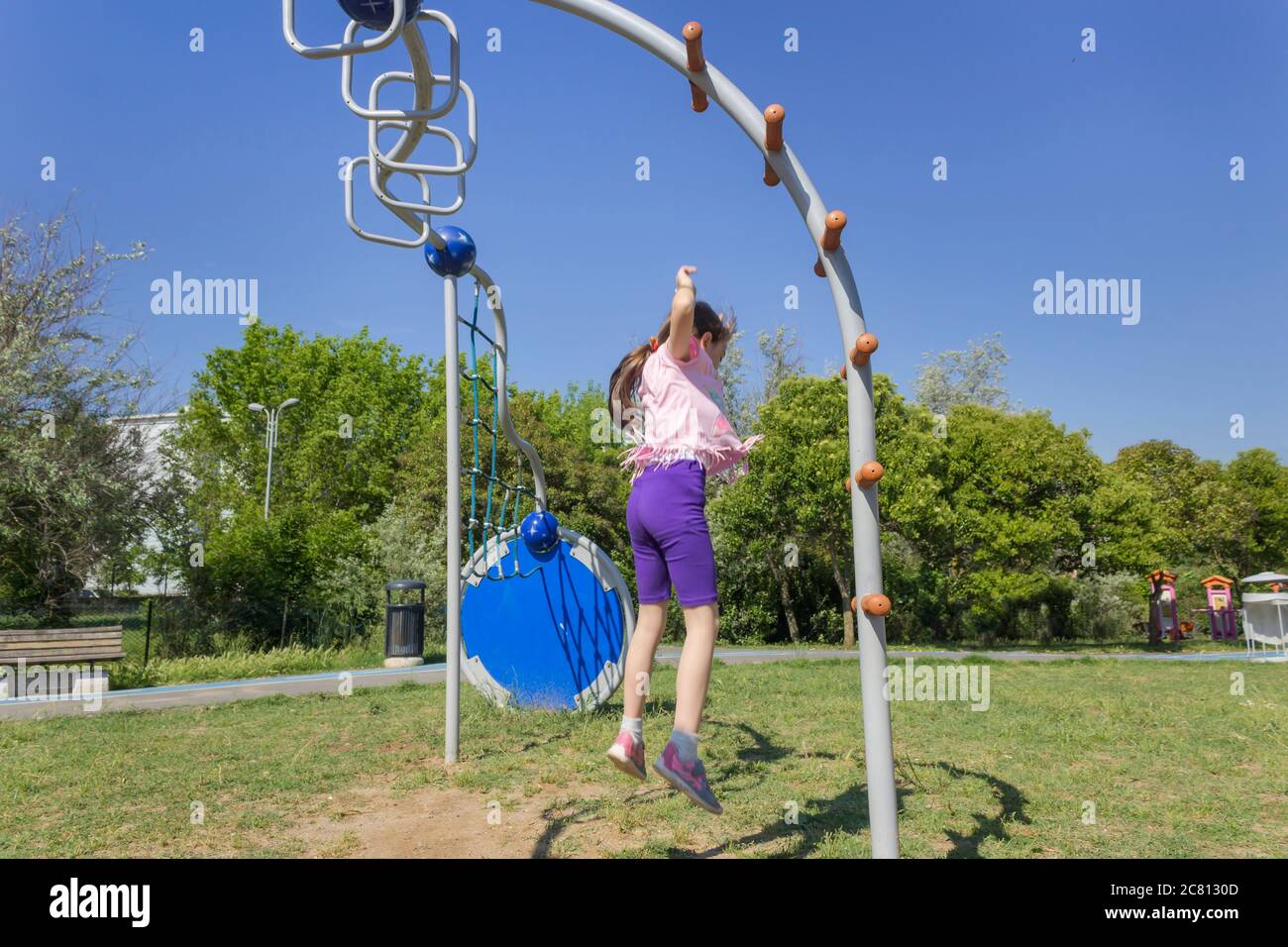 Teenage girl is playing at the playpen Stock Photo - Alamy