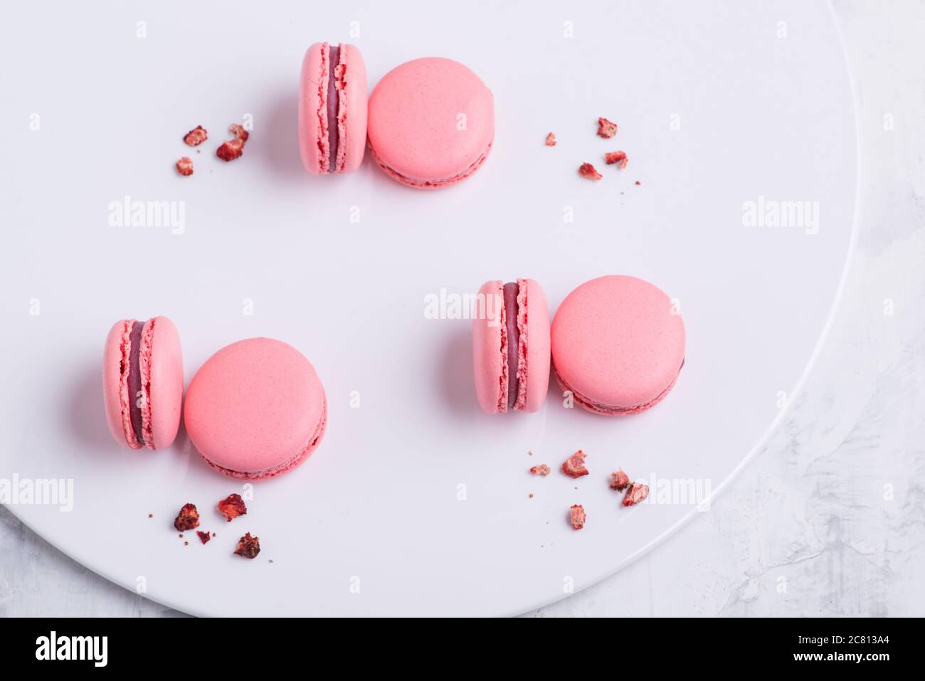 pink Macaroni cookie French on white plate. Studio photo Stock Photo ...