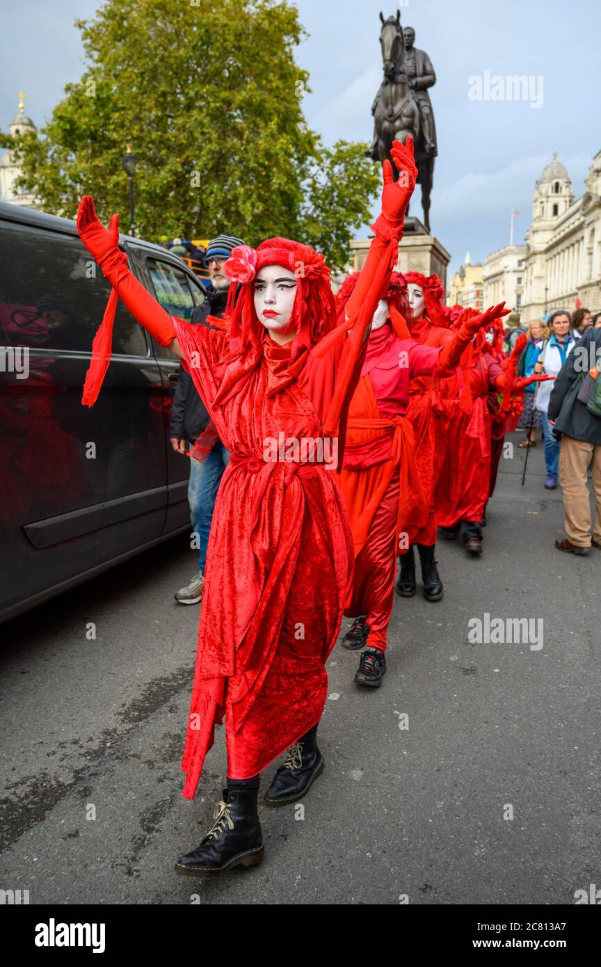 LONDON - OCTOBER 18, 2019: Full length, vertical shot of Red Brigade ...
