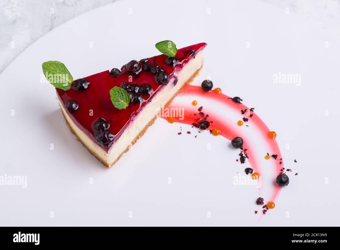 delicious cake with berries on a white plate Stock Photo - Alamy
