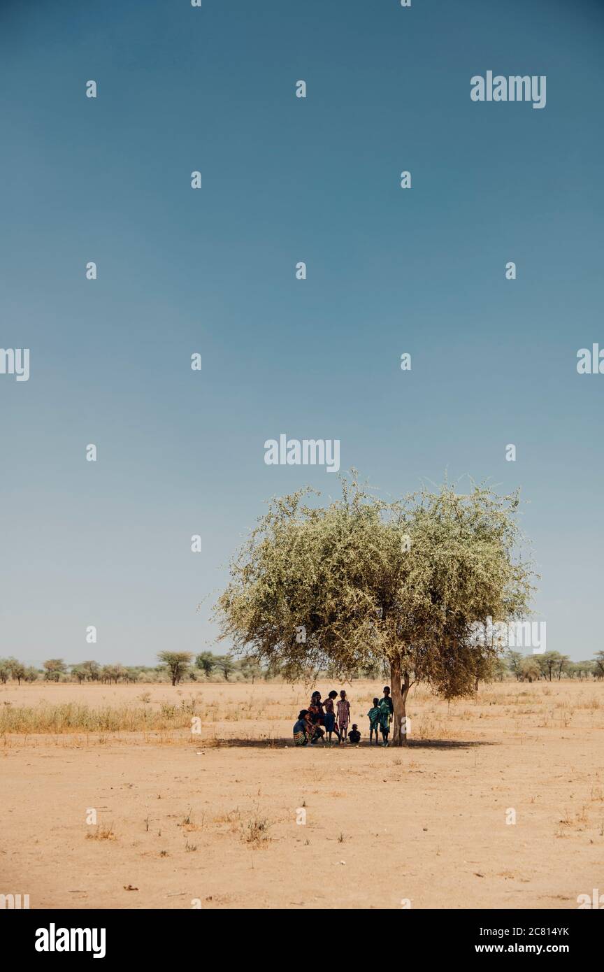 Nomadic women and children from Afar, Northern Ethiopia shelter from ...