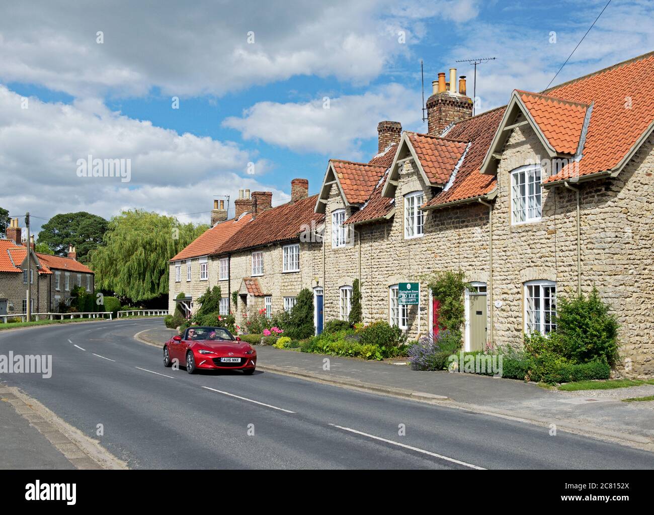 Mazda MX-5 open-topped sports car in the estate village of Hovingham ...