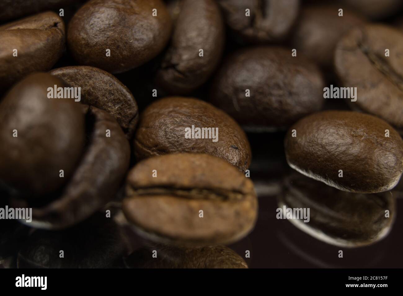 Fragrant fried coffee beans. close-up texture Stock Photo - Alamy