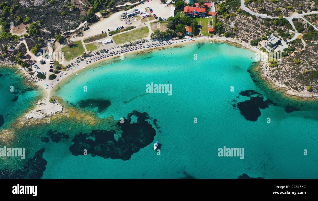 Aerial shot of a seashore with trees and houses at daytime Stock Photo ...