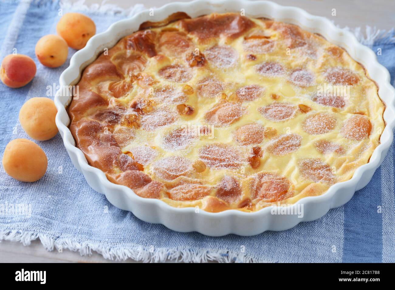Just baked apricot clafoutis, the traditional French dessert, in a ...