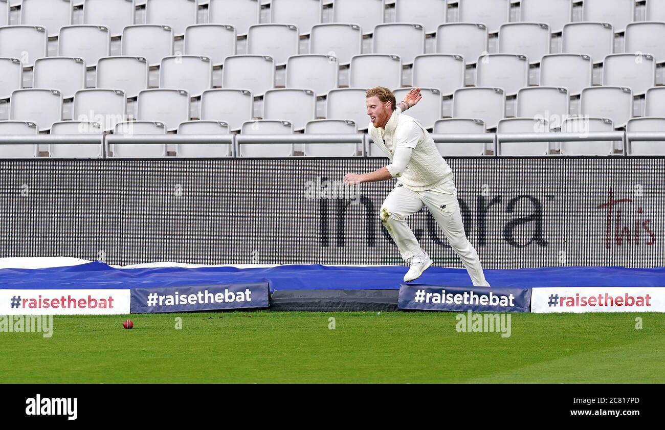 England's Ben Stokes fields the ball on the boundary from his own ...