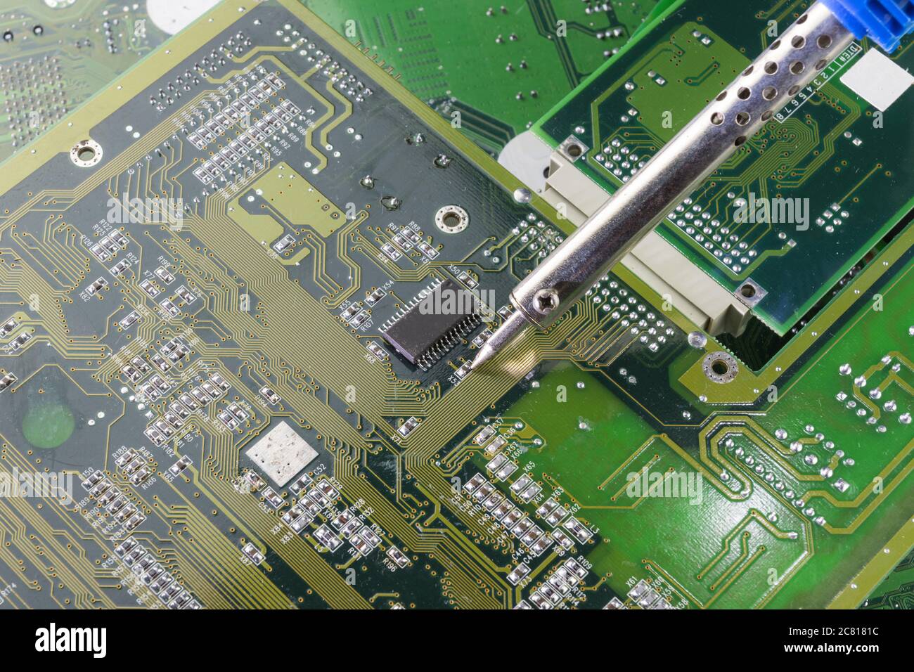 Solder the circuit board with a soldering iron hi-res stock photography ...