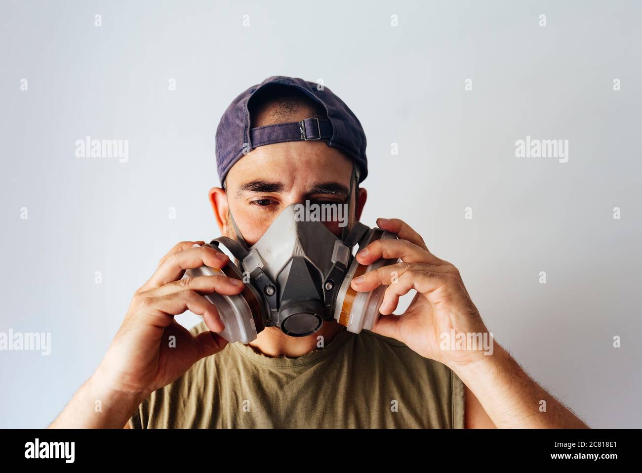 Portrait of airbrush painter putting on his protective mask Stock Photo ...