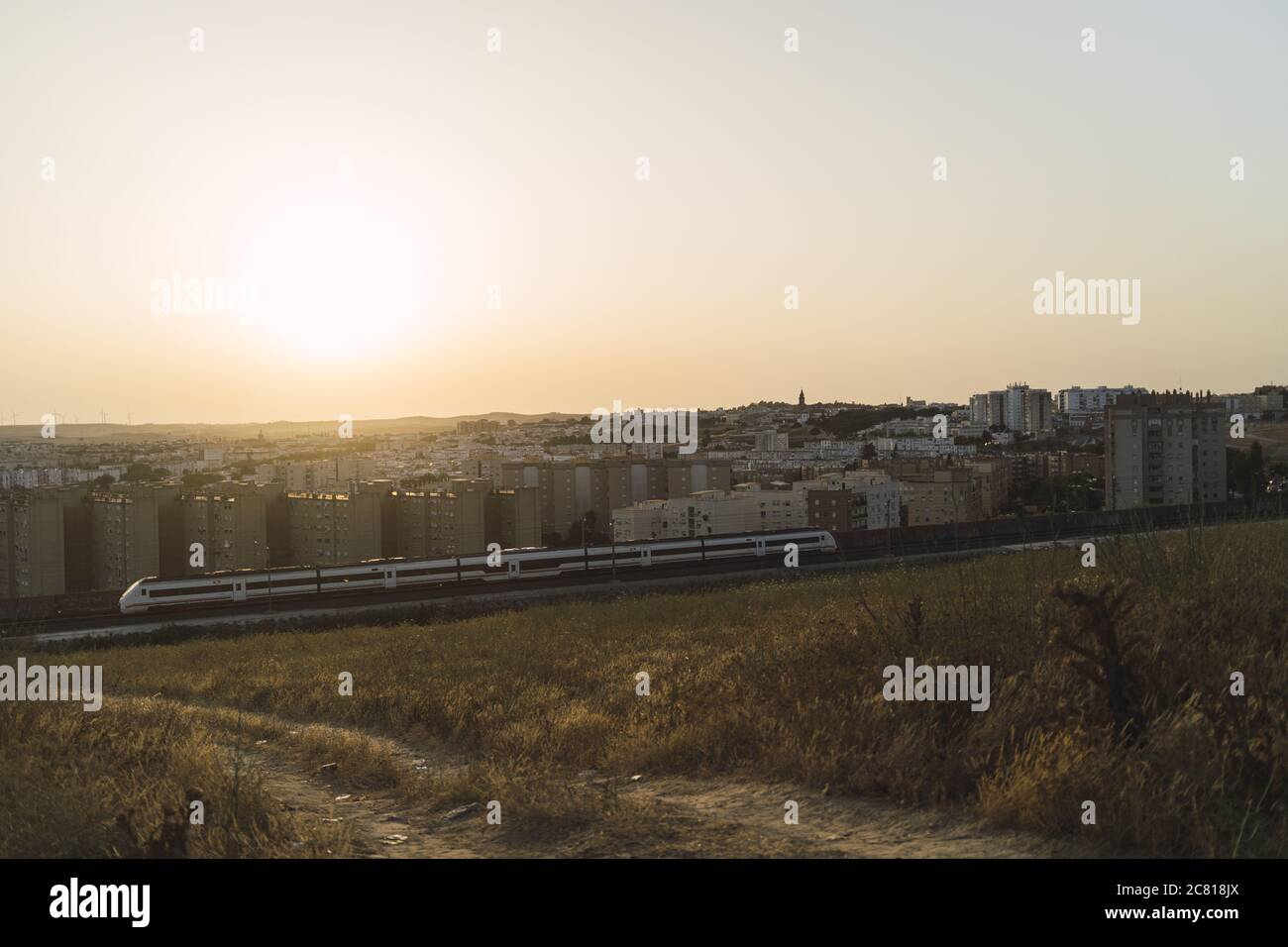 Beautiful view of subway train with buildings on the back during ...