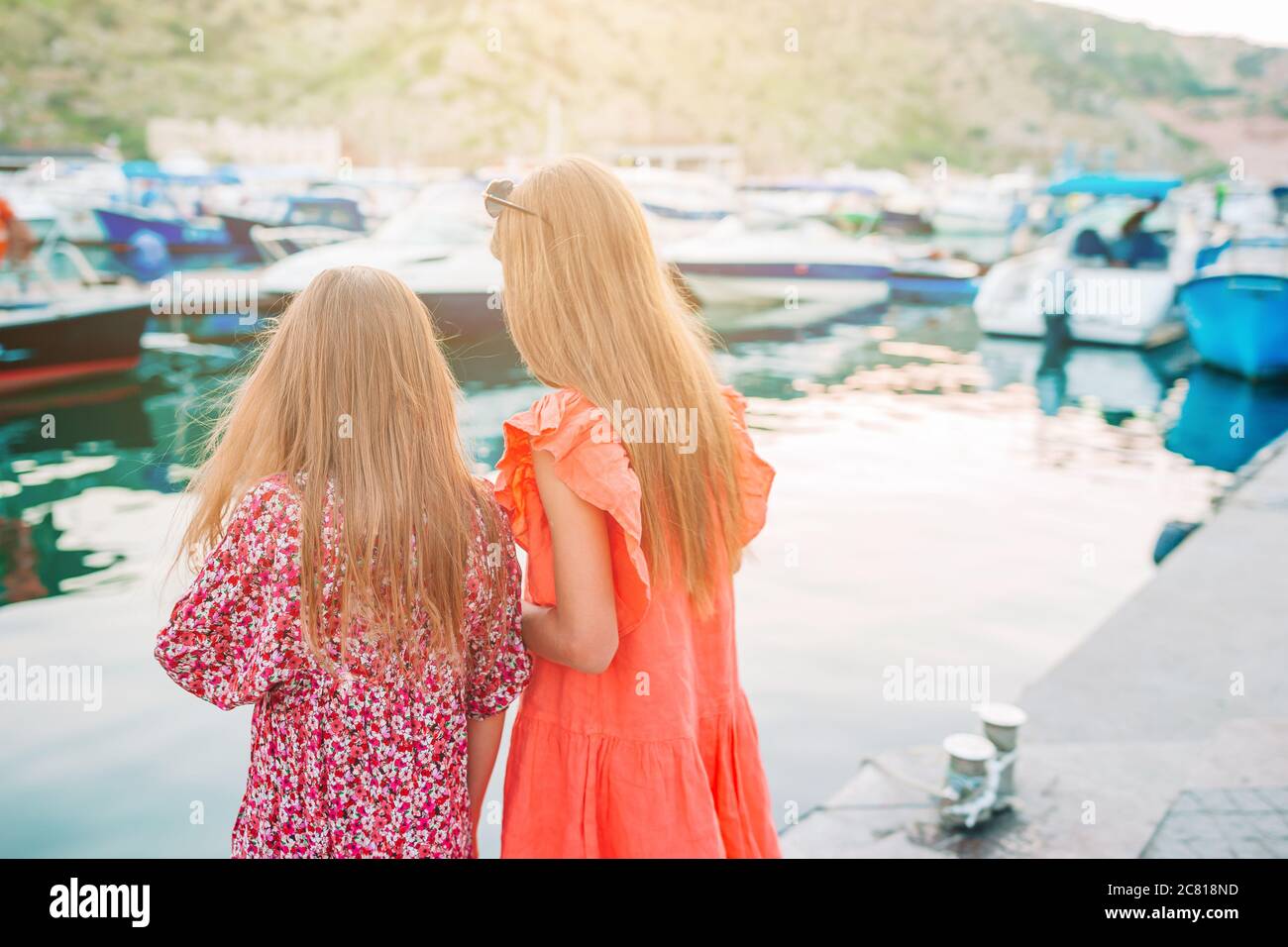 Adorable little girls in port at summer day Stock Photo - Alamy