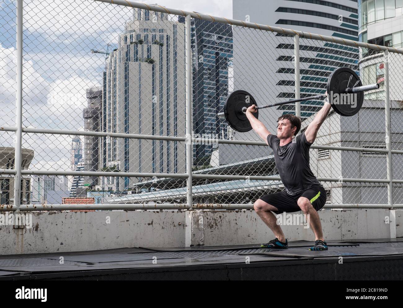 man training at rooftop gym in Bangkok Stock Photo - Alamy