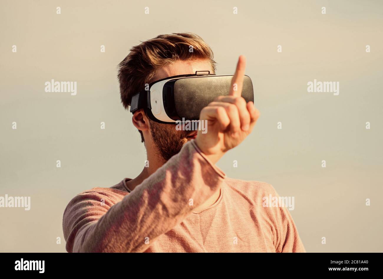 VR communication. Man explore VR sky background. VR technology and ...