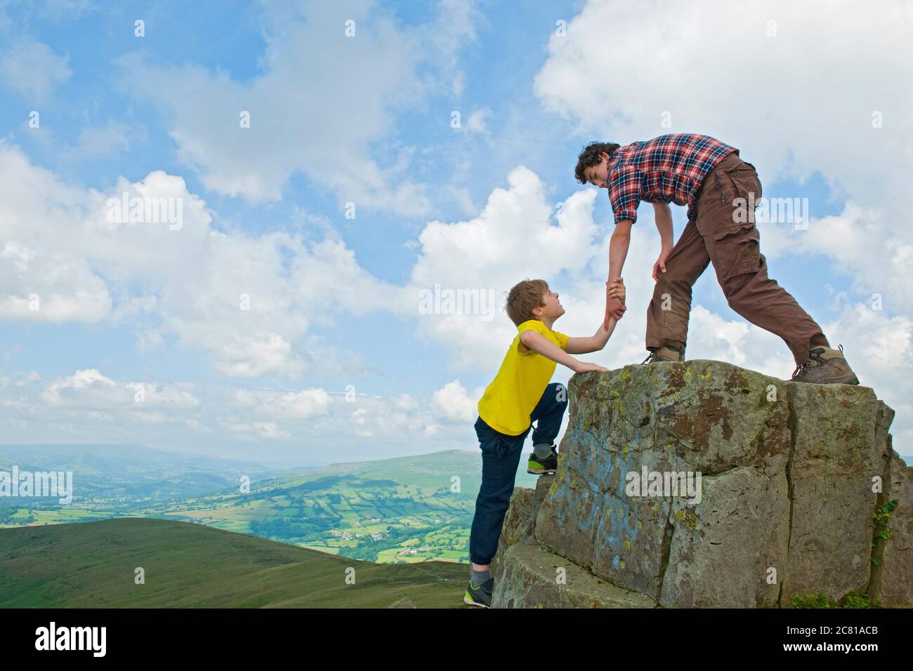 Helping hand rock climbing hi-res stock photography and images - Alamy